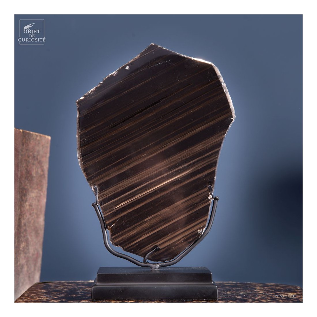 slice of Midnight Lace Obsidian on black base.