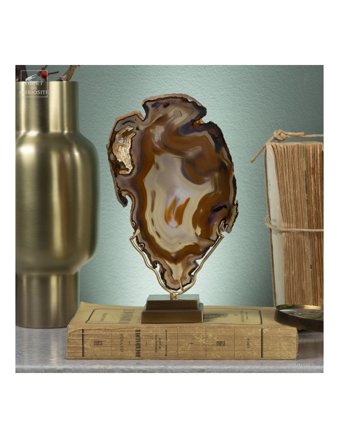 Golden agate slice on brass base